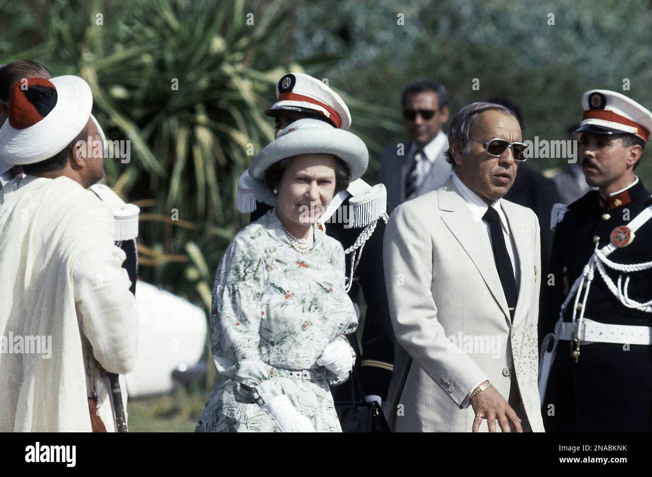 Britain's Queen Elizabeth II walks with Morocco's King Hassan during ...