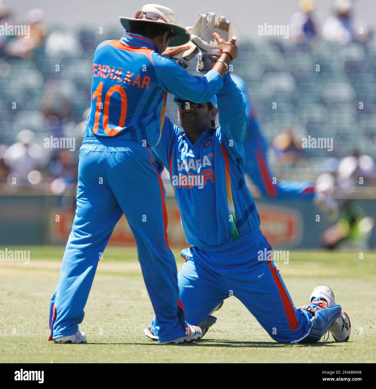 India's Sachin Tendulkar, left, congratulates Mahendra Dhoni after Sri ...
