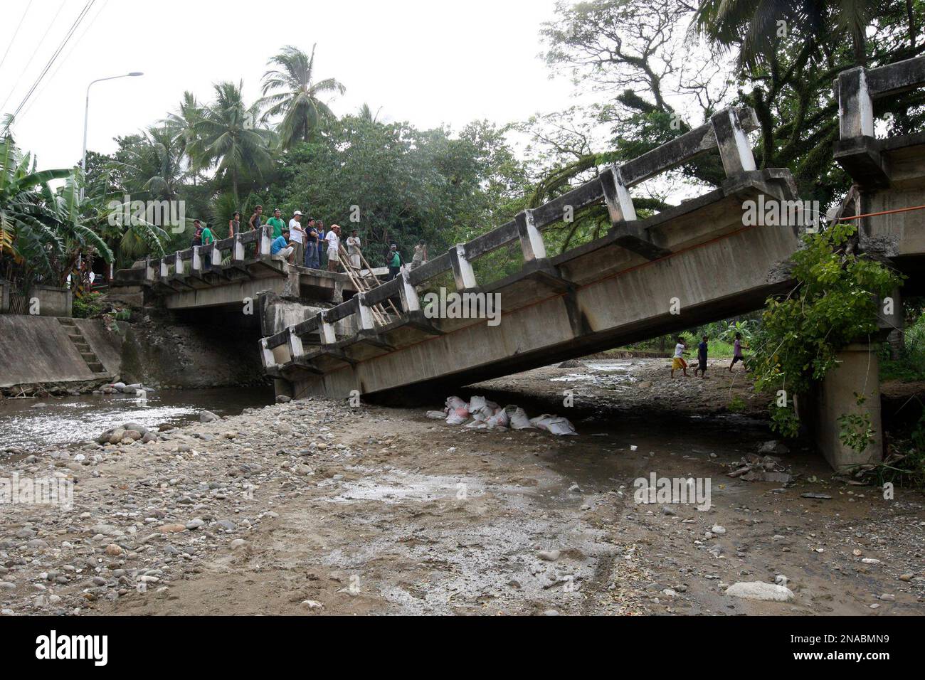 In this photo taken on Tuesday, Feb. 7, 2012, residents use improvised ...