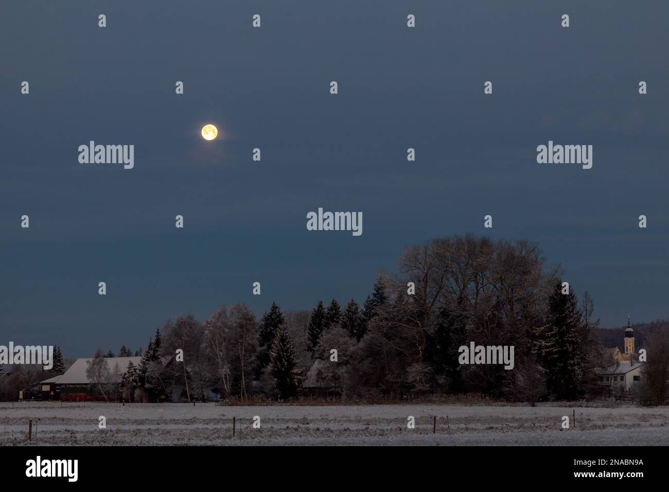 Full moon over a field in Bavaria on a cold morning in winter Stock ...