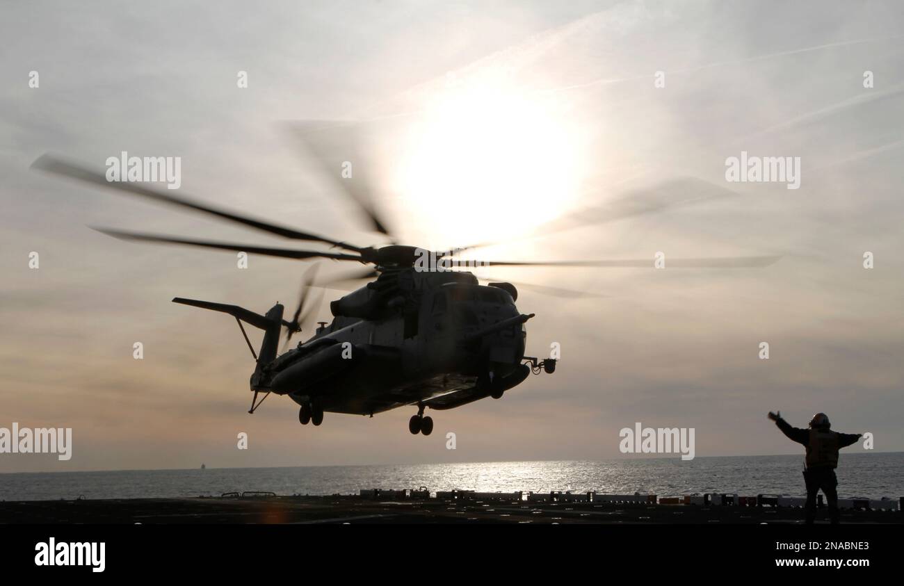 A MH53 Sea Stallion lands aboard the Amphibious Assault Ship USS Wasp in support of Operation ...