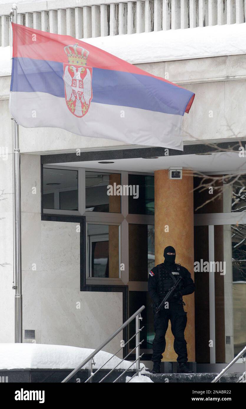 A member of the Serbian Gendarmerie guards the entrance to a high ...