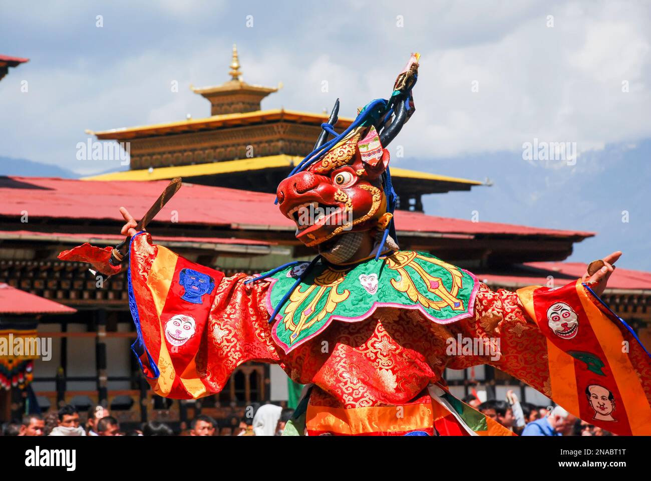 A performer in costume does a Cham dance at the Bhutanese Paro Tshechu ...