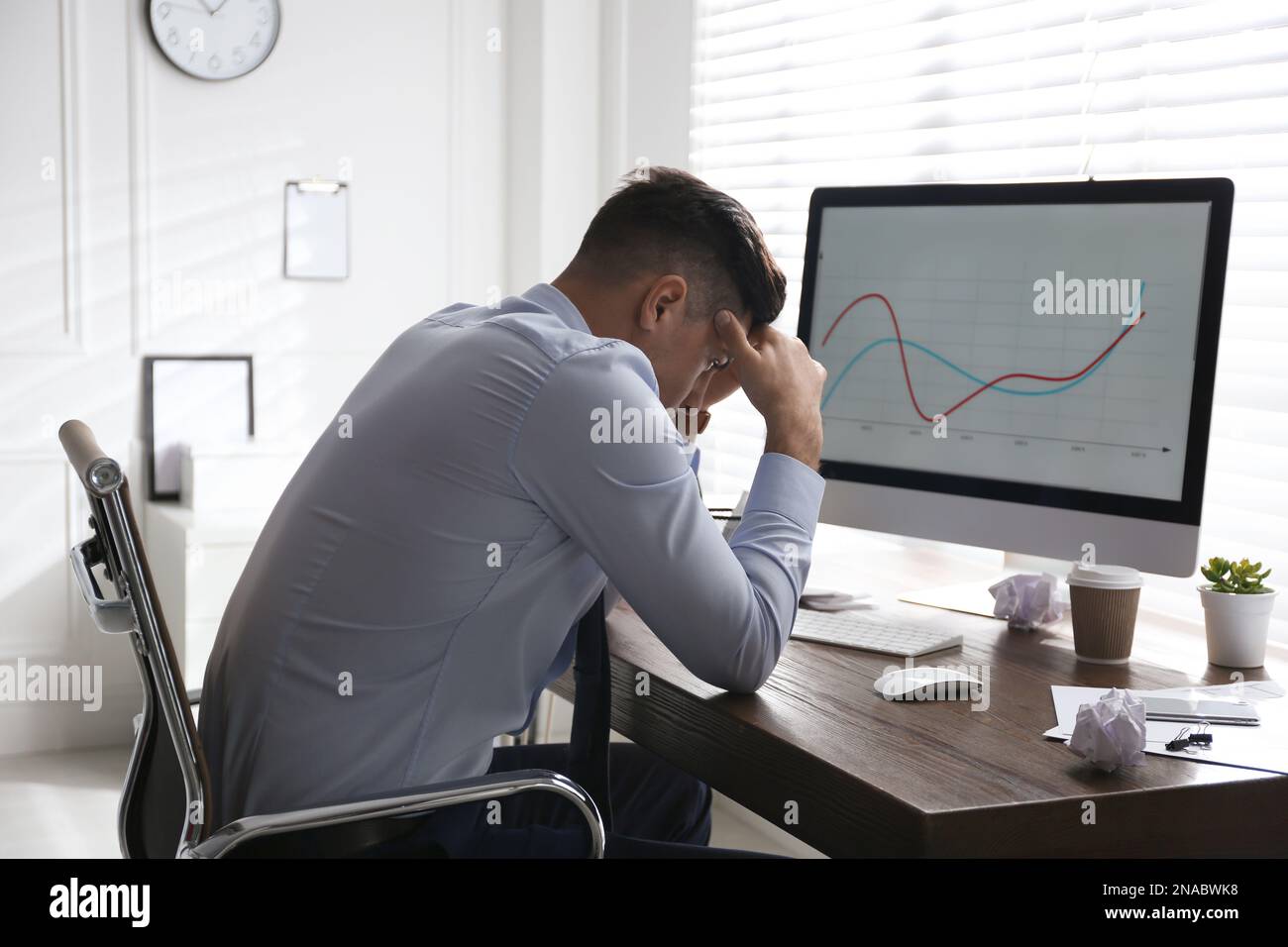 Businessman stressing out at workplace in office Stock Photo - Alamy