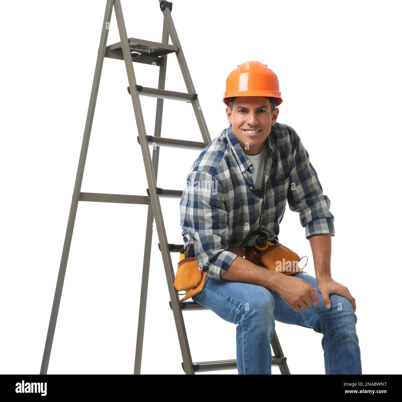 Professional builder sitting on metal ladder against white background ...