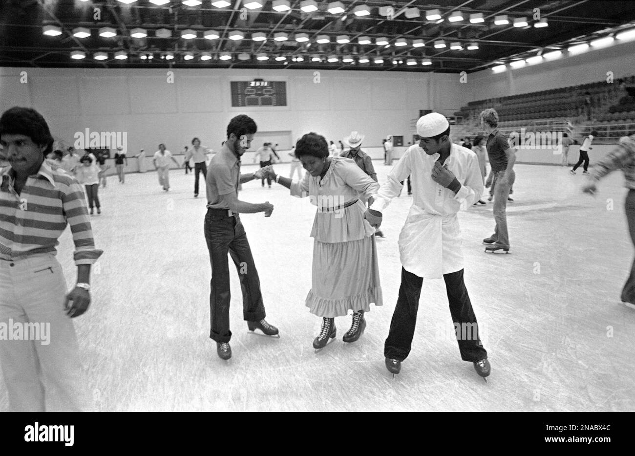An Arab wearing traditional dish-dash on the ice at Leisureland's rink ...