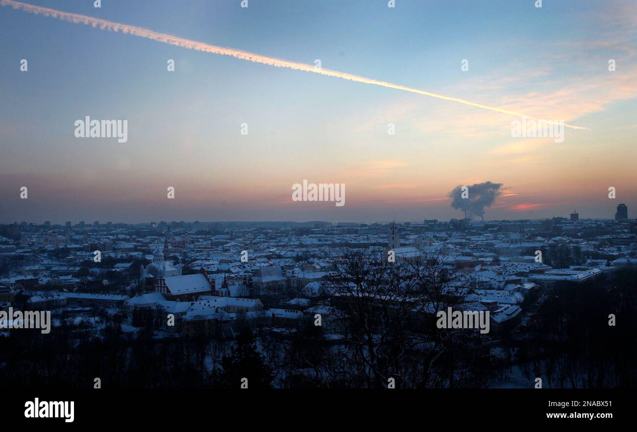 A view of the snow covered Vilnius during the sun sets over Vilnius ...