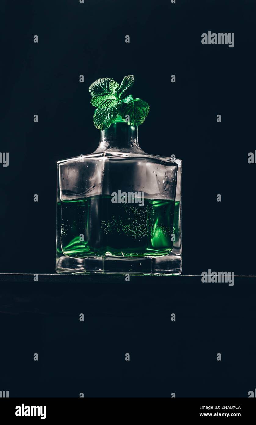 Stylized bottle of absinthe. Background, mockup Stock Photo - Alamy