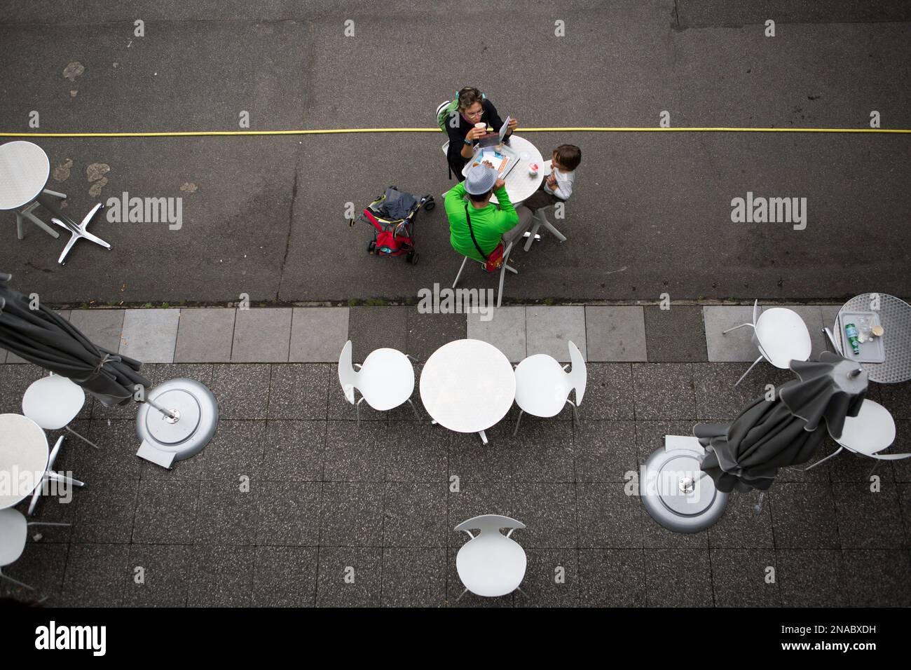 At the Parc de la Villette, an aerial view of a family eating a meal in ...
