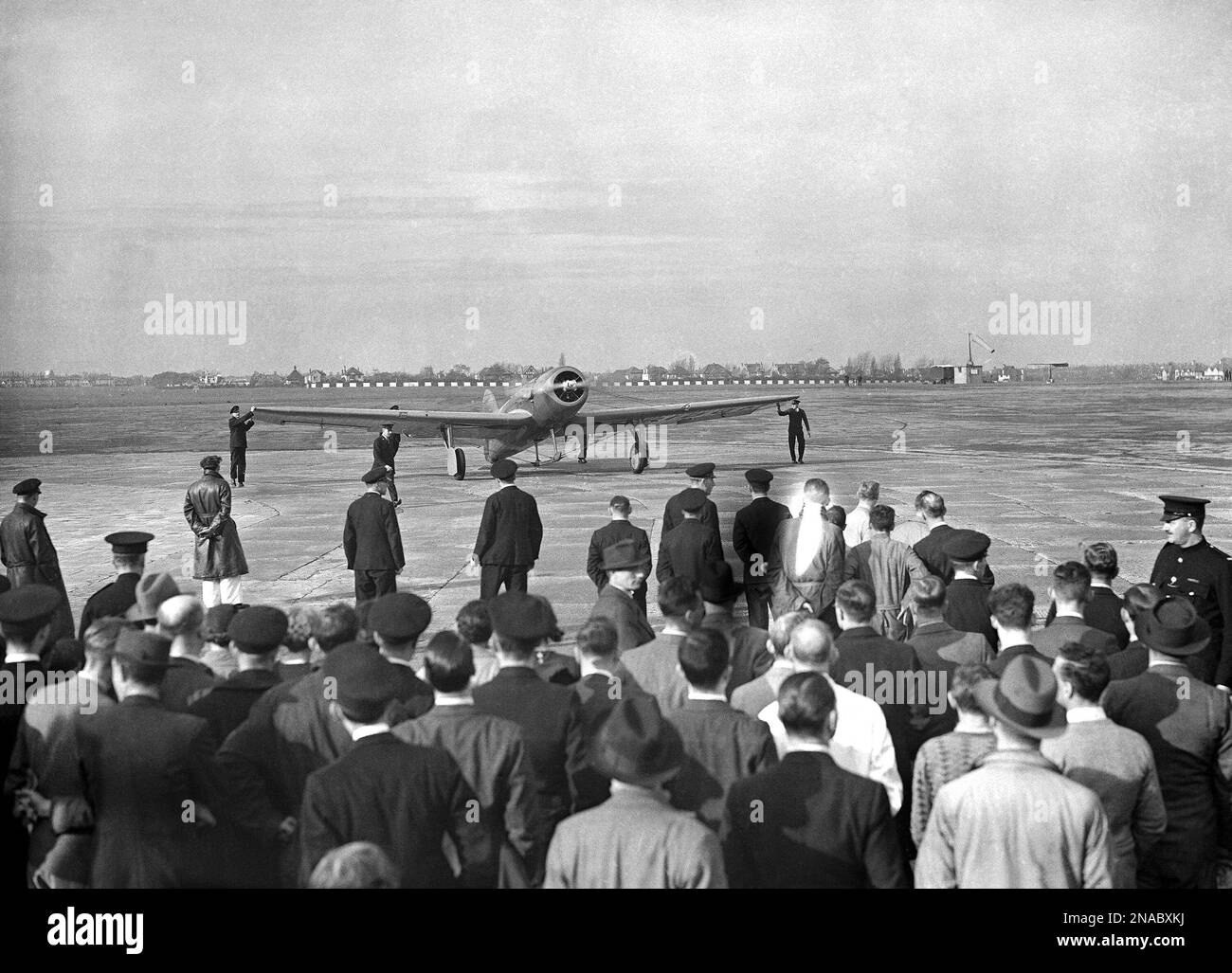 James Allan Mollison's, plane landing at Croydon, London,watched by a ...