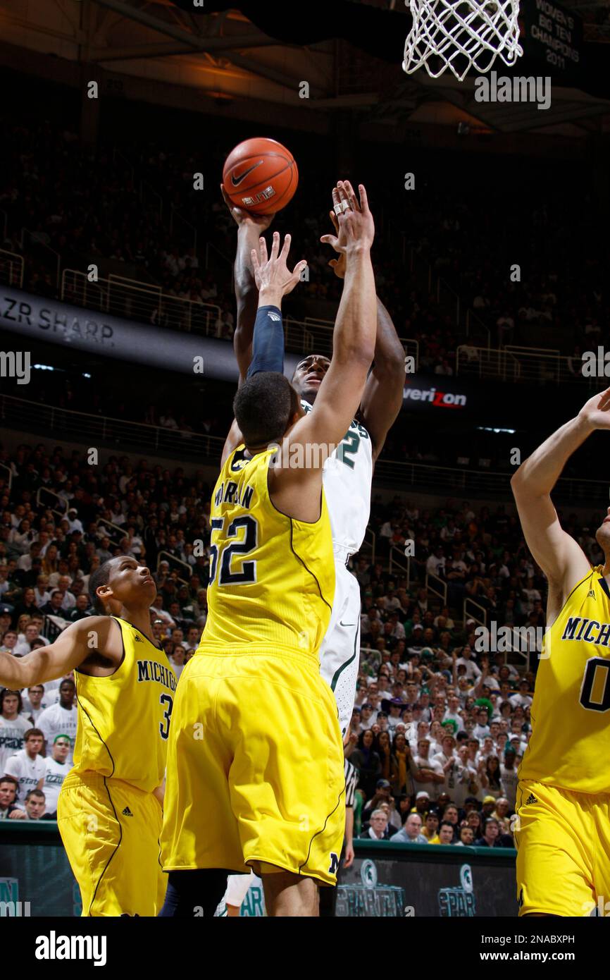Michigan State's Branden Dawson shoots against Michigan's Jordan Morgan ...