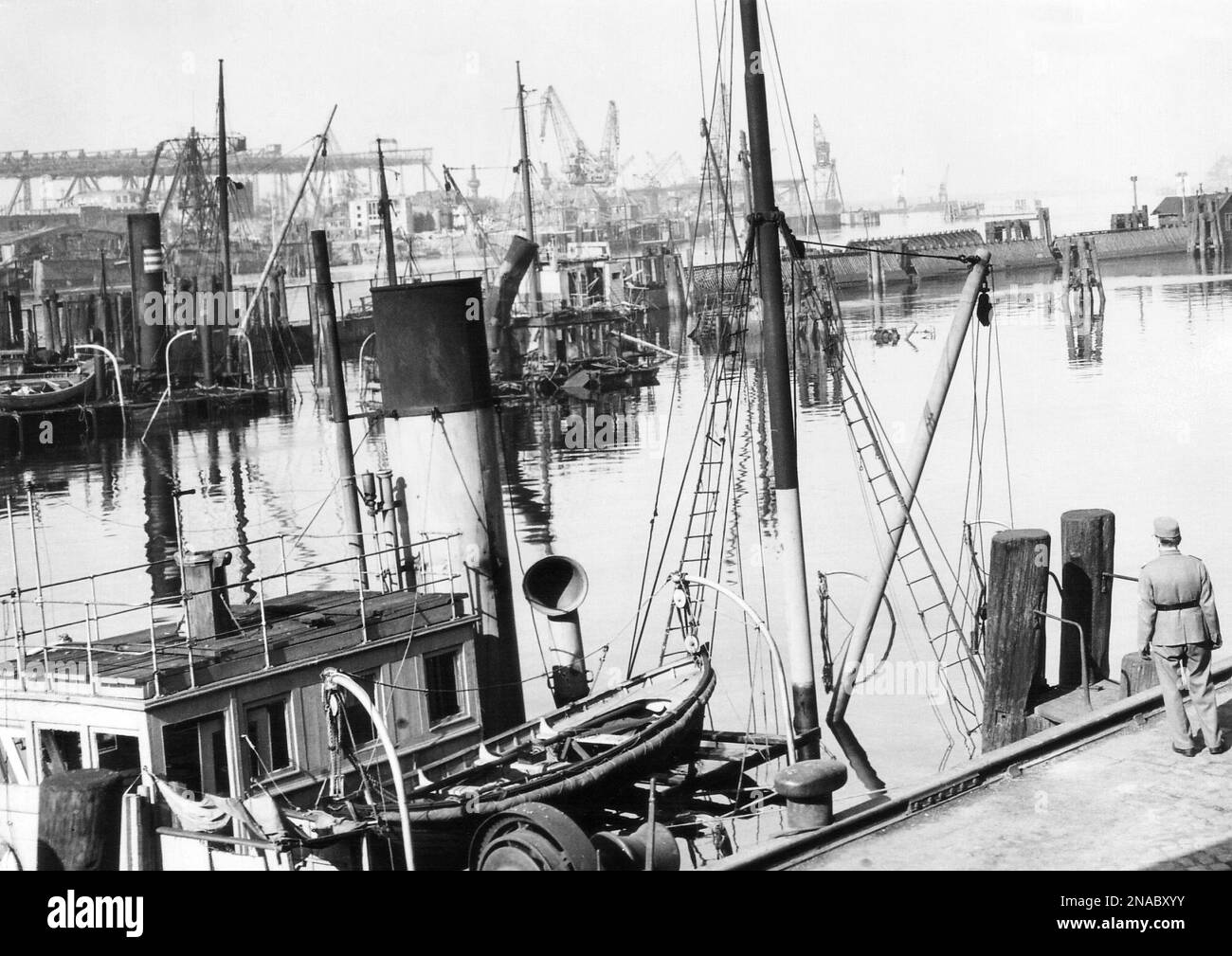 German cargo ships half submerged in one of the docks at Hamburg on May ...