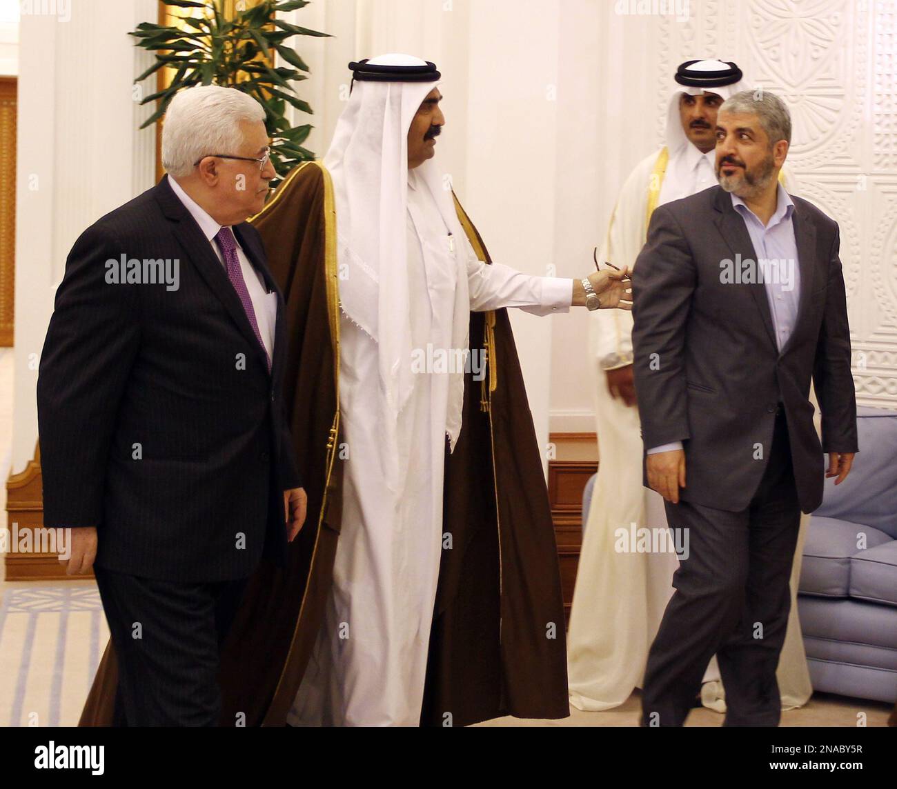 Emir of Qatar Sheikh Hamad Bin Khalifa Al-Thani , center, and Palestinian President Mahmoud ...
