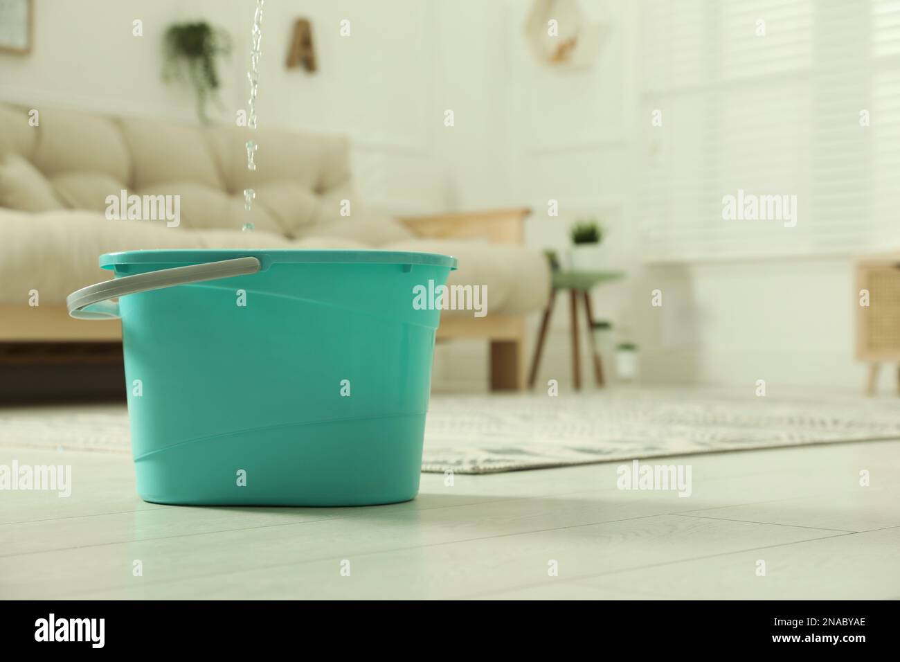 Water dripping into bucket hi-res stock photography and images - Alamy