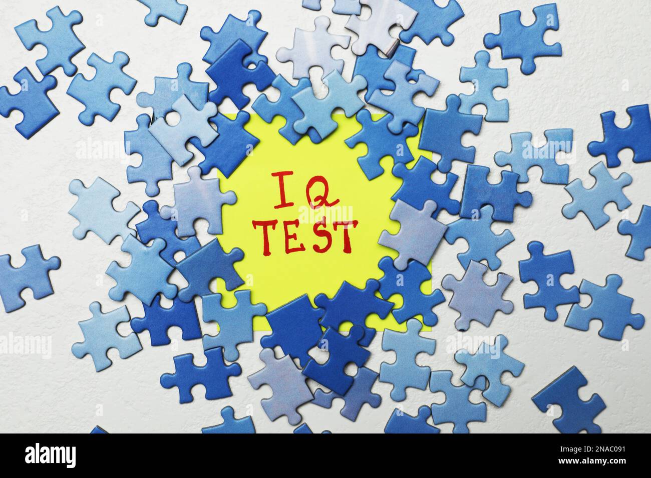 Paper with words IQ Test, puzzles on white table, flat lay Stock Photo ...