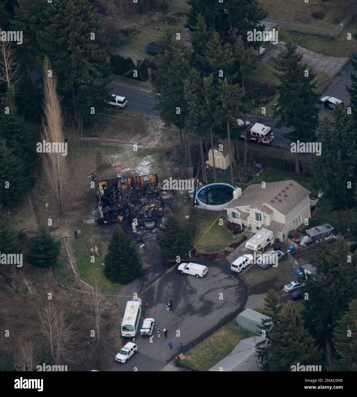 The smoldering remains of a house, left, where an explosion killed Josh ...
