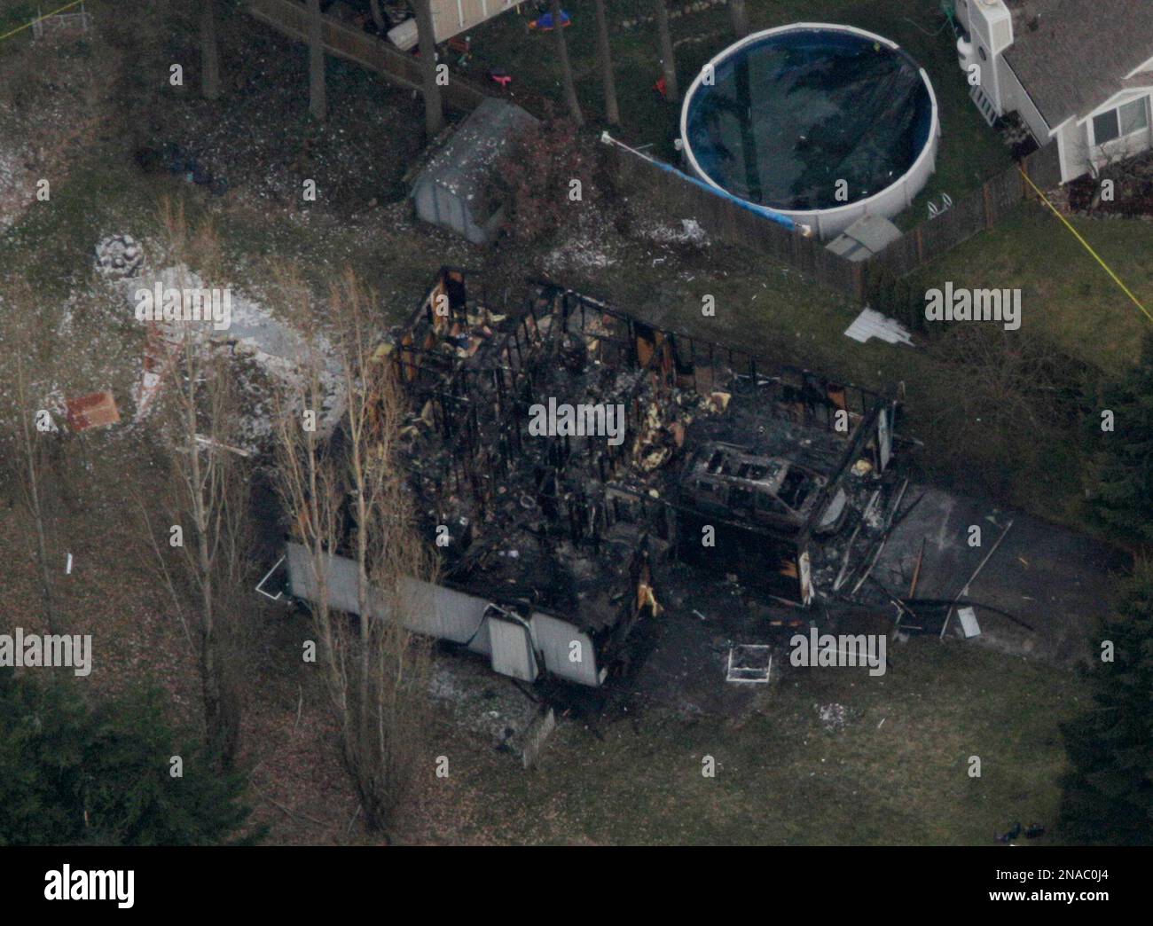 The smoldering remains of a house, left, where an explosion killed Josh ...