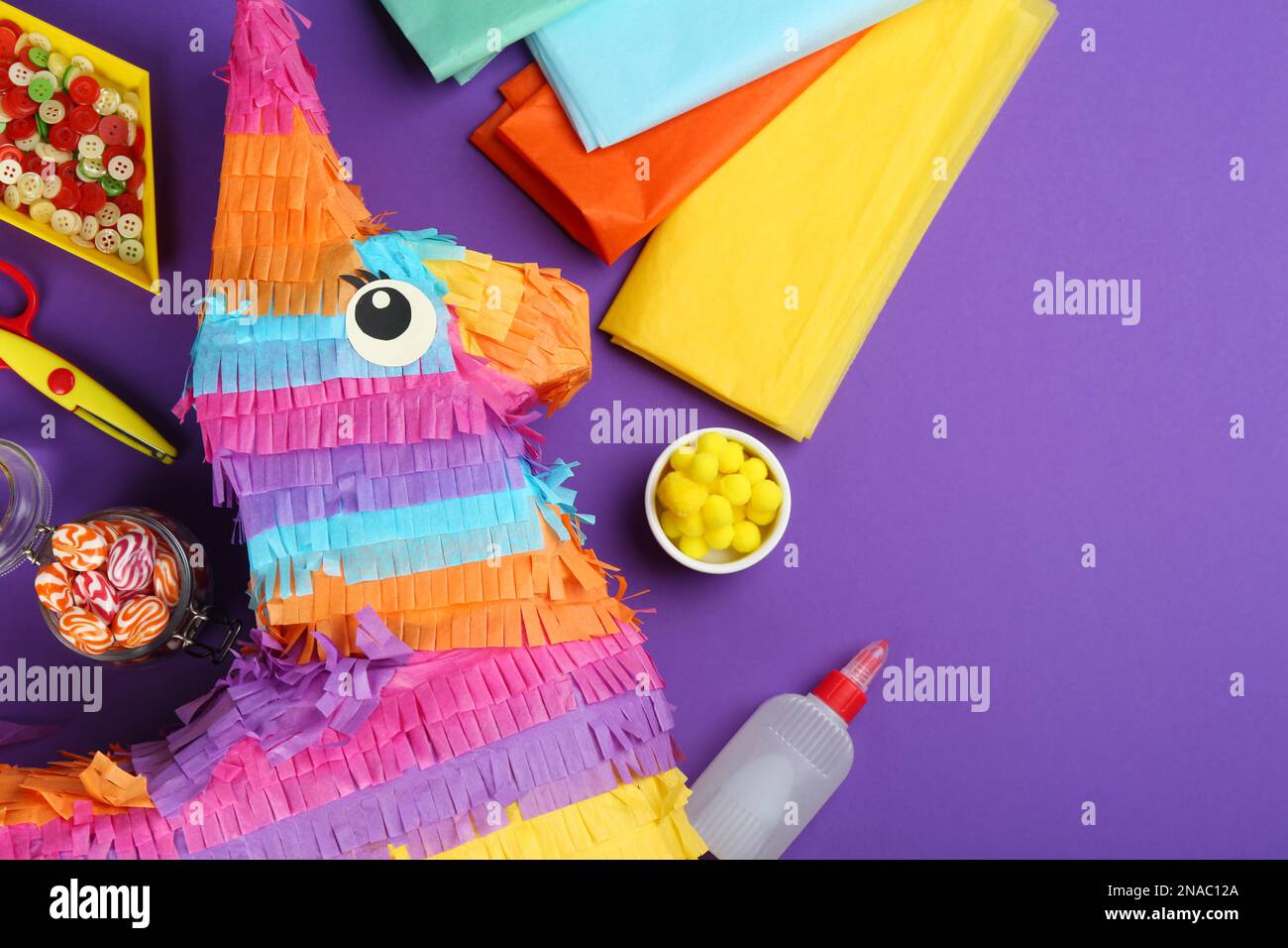 Flat lay composition with cardboard donkey on purple background, space ...