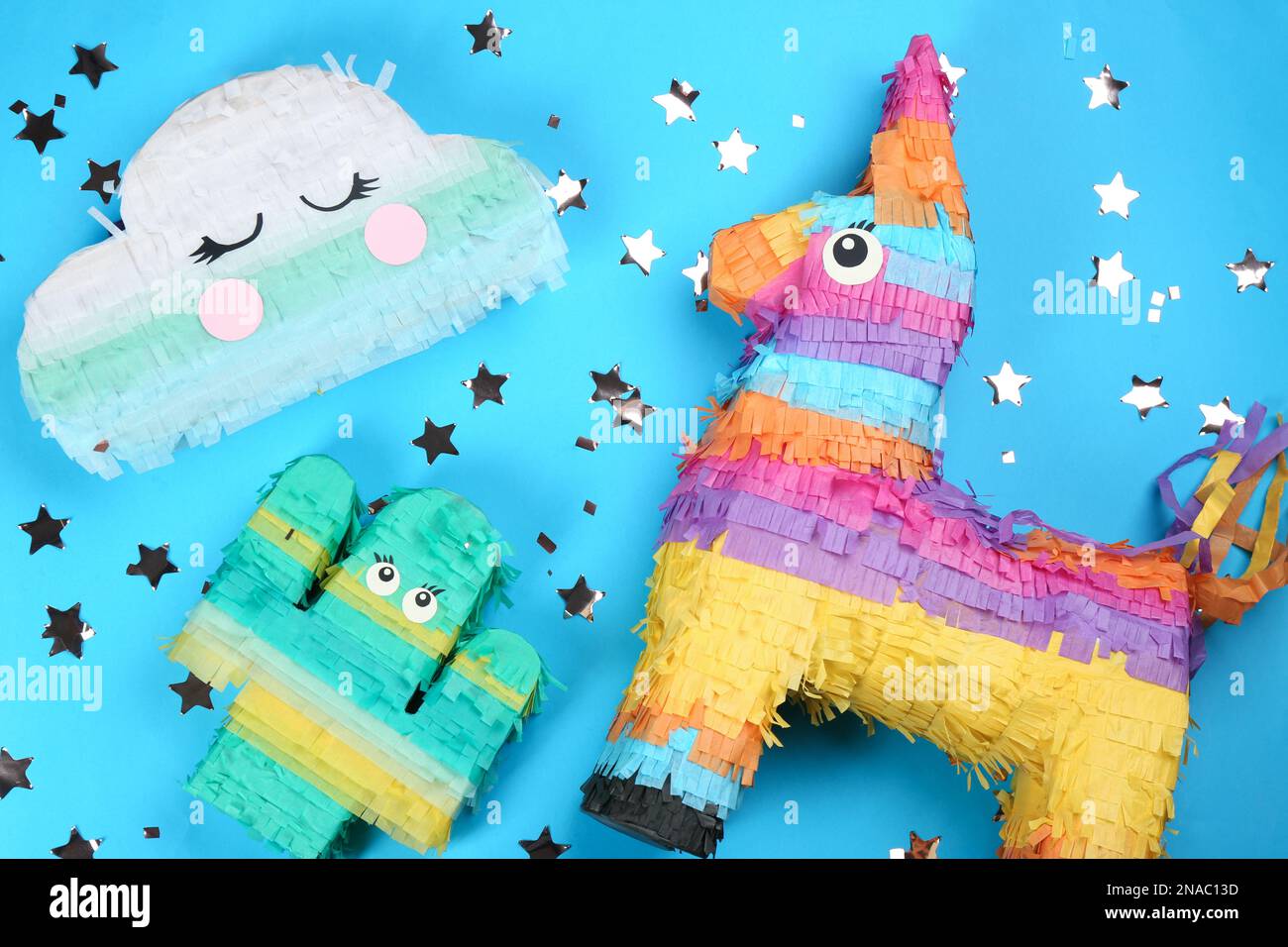 Different bright pinatas on light blue background, flat lay Stock Photo ...