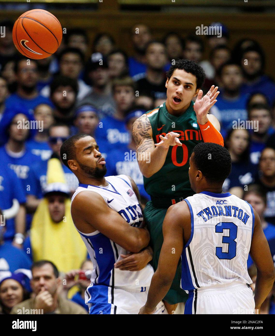 Duke's Josh Hairston and Tyler Thornton (3) defend against Miami's ...