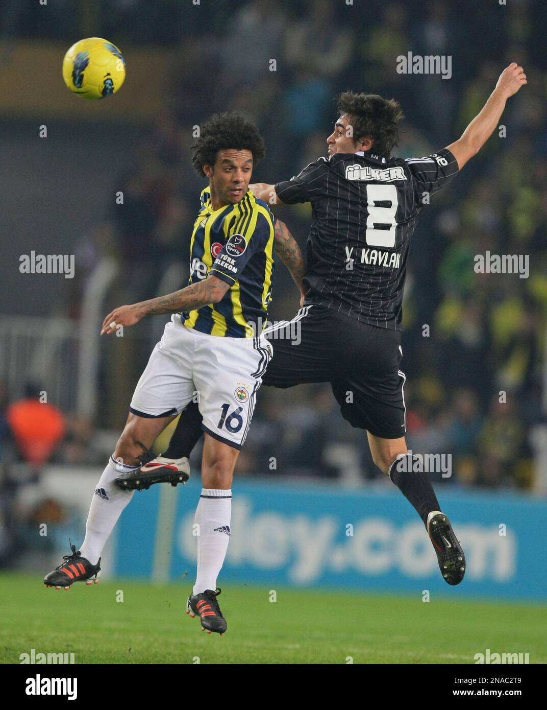 Christian Baroni of Fenerbahce, left, and Veli Kavlak of Besiktas, left ...