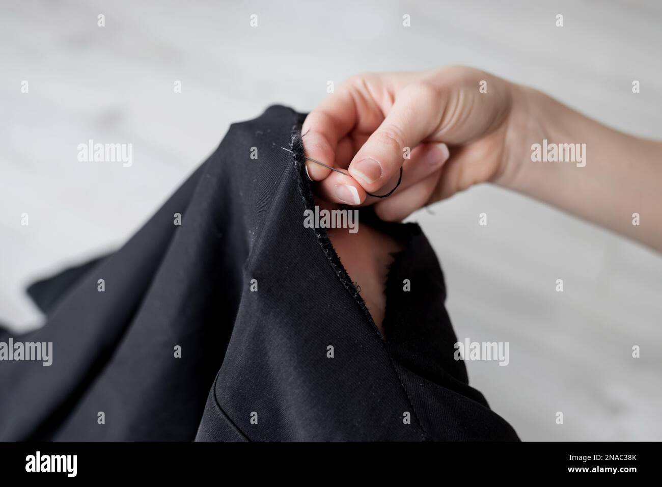 sewing worn - out old fabric. repair and restoration of clothing. small ...