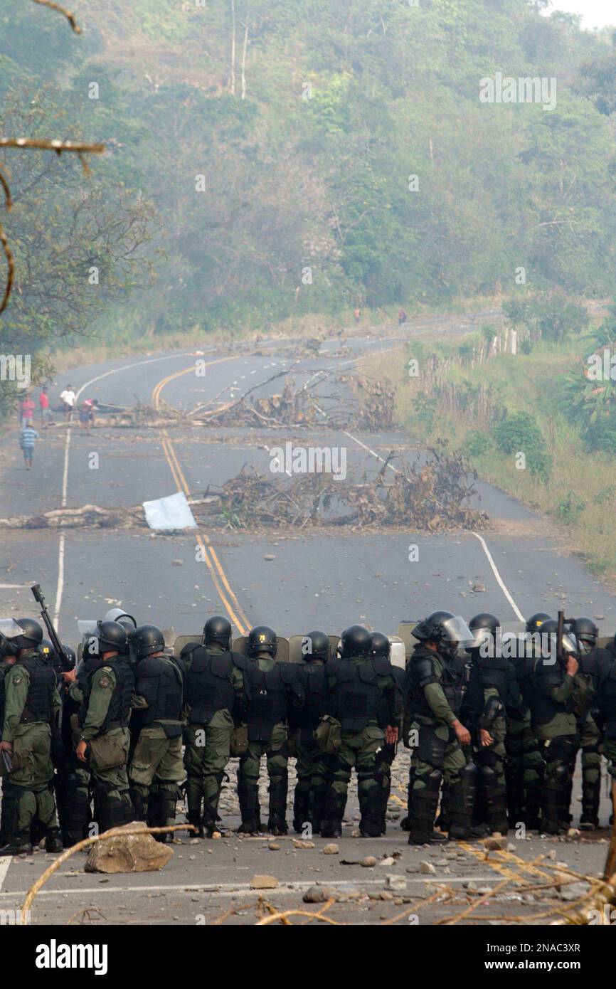 Riot police guard the Pan American highway after clearing a road ...