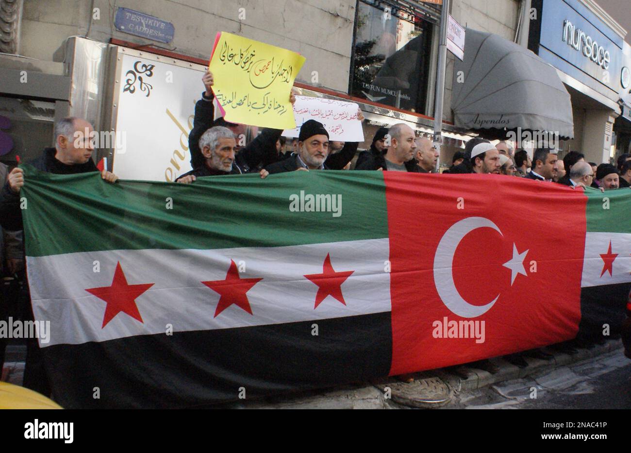Hundreds of Syrians living in Turkey and human right activists shout ...