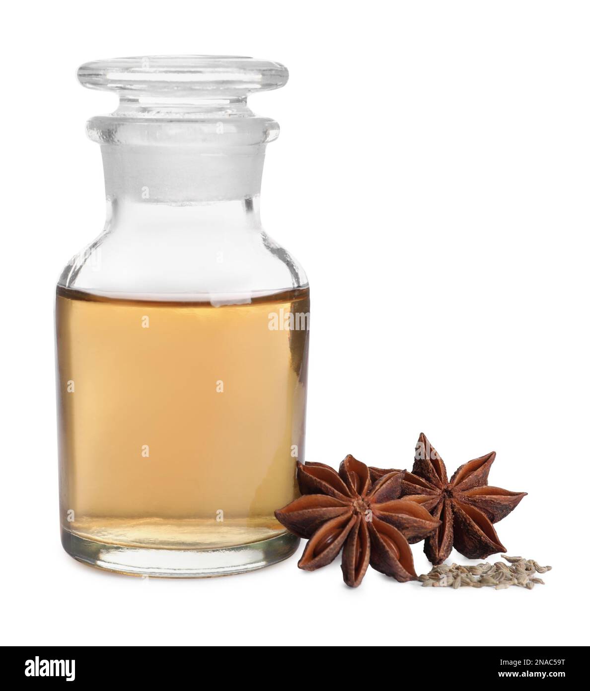 Anise essential oil and spice on white background Stock Photo - Alamy