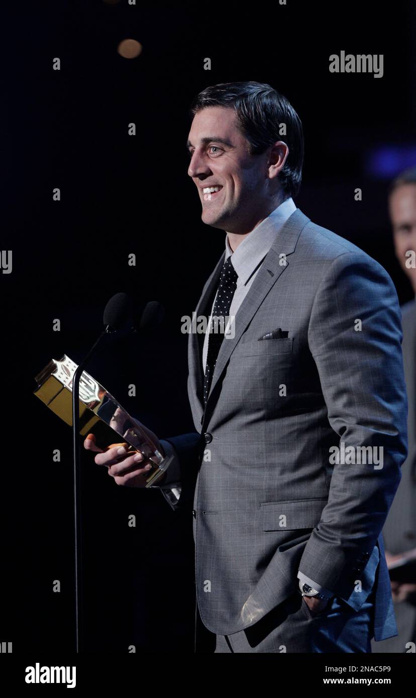 Green Bay Packers Aaron Rodgers receives the MVP award during the ...
