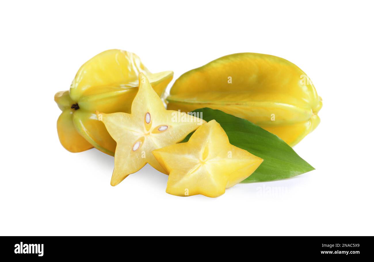 Cut and whole carambolas with green leaf on white background Stock ...