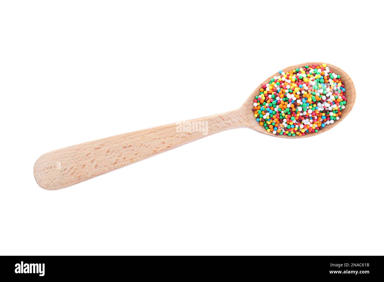 Colorful sprinkles in spoon on white background, top view ...