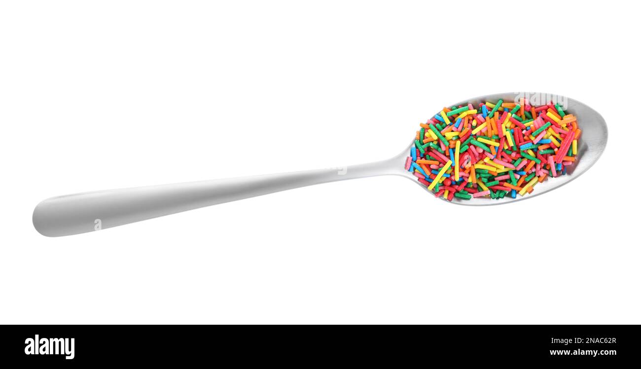 Colorful sprinkles in spoon on white background, top view ...