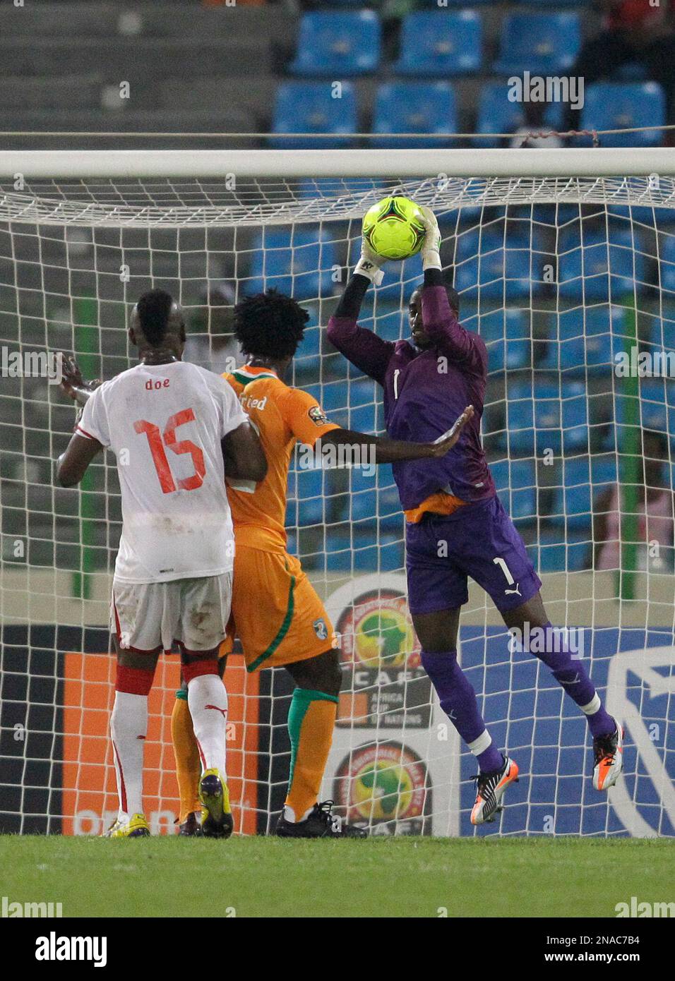 Ivory Coast's goalkeeper Boubacar Barry, right, stops a shot by ...