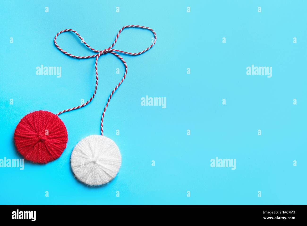 Traditional martisor on light blue background, top view with space for ...