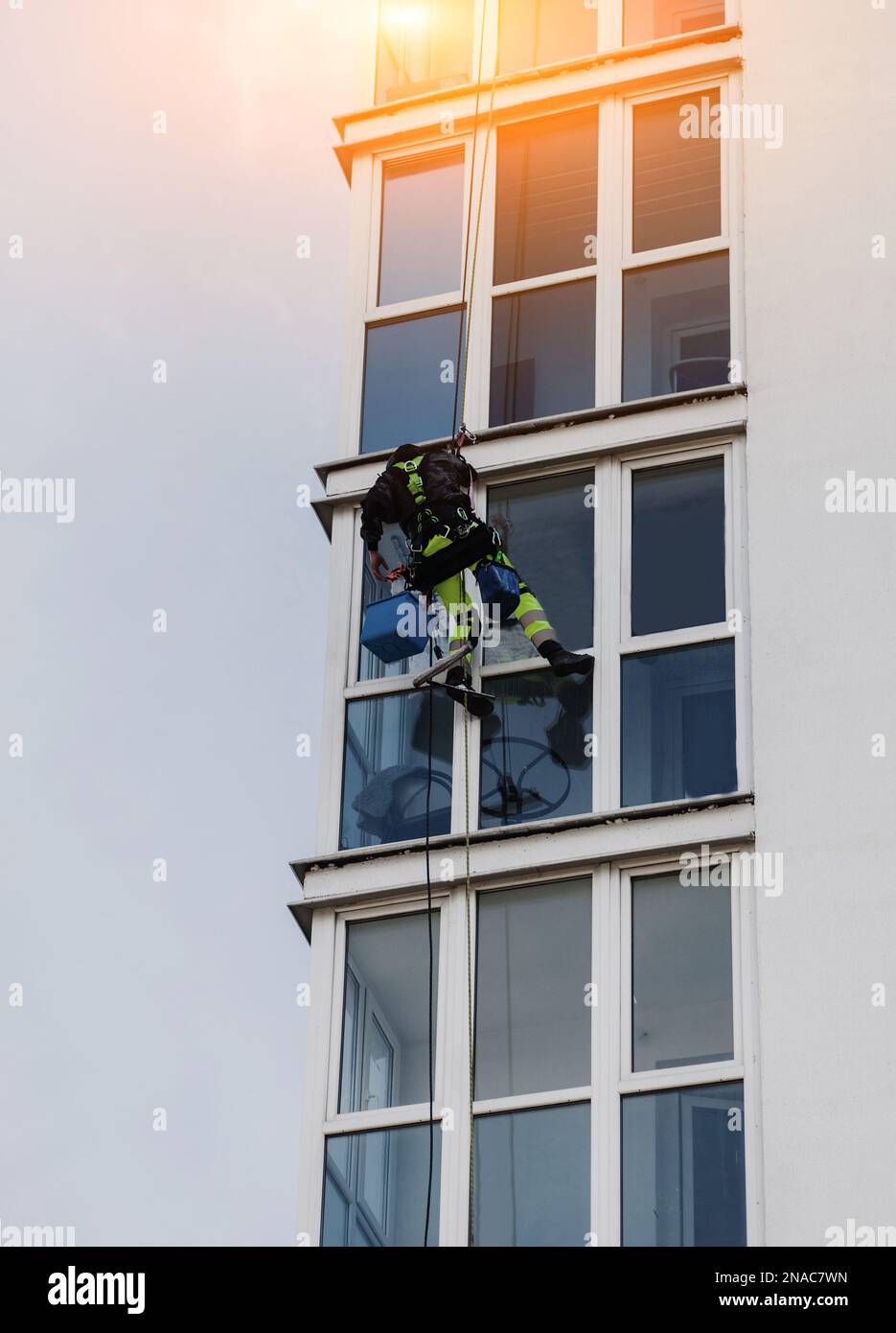 Window washers on a office building. Industrial climbing - facade ...