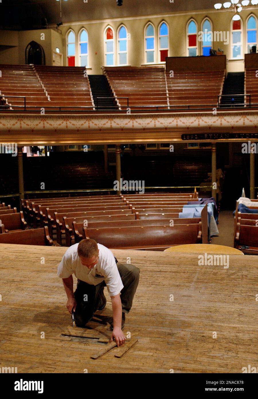 Jay McClellan removes a piece of the floor of the stage at The Ryman ...