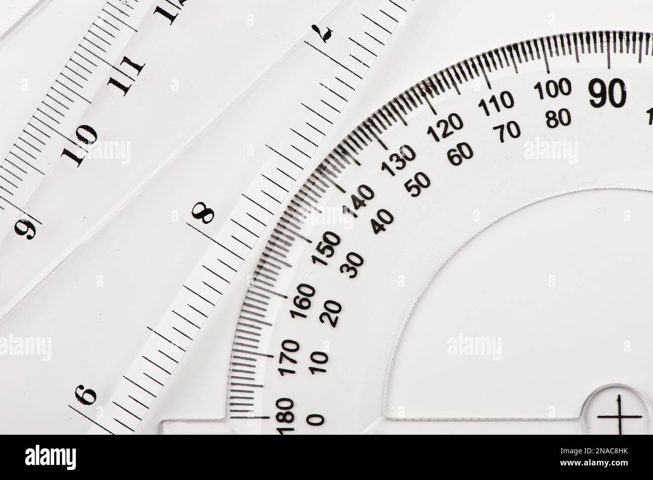 Transparent plastic ruler and protractor for measuring Stock Photo - Alamy
