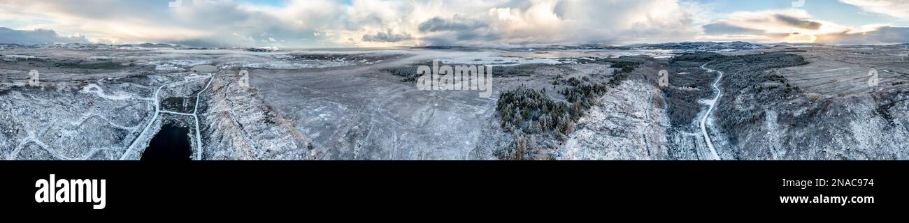 Aerial view of snow covered Bonny Glen Woods by Portnoo in County ...