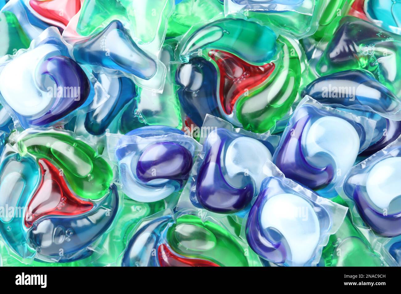 Many different laundry capsules as background, top view Stock Photo - Alamy
