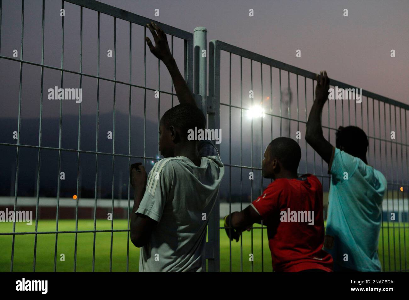 Neighborhood kids watch the Equatorial Guinea national soccer team ...