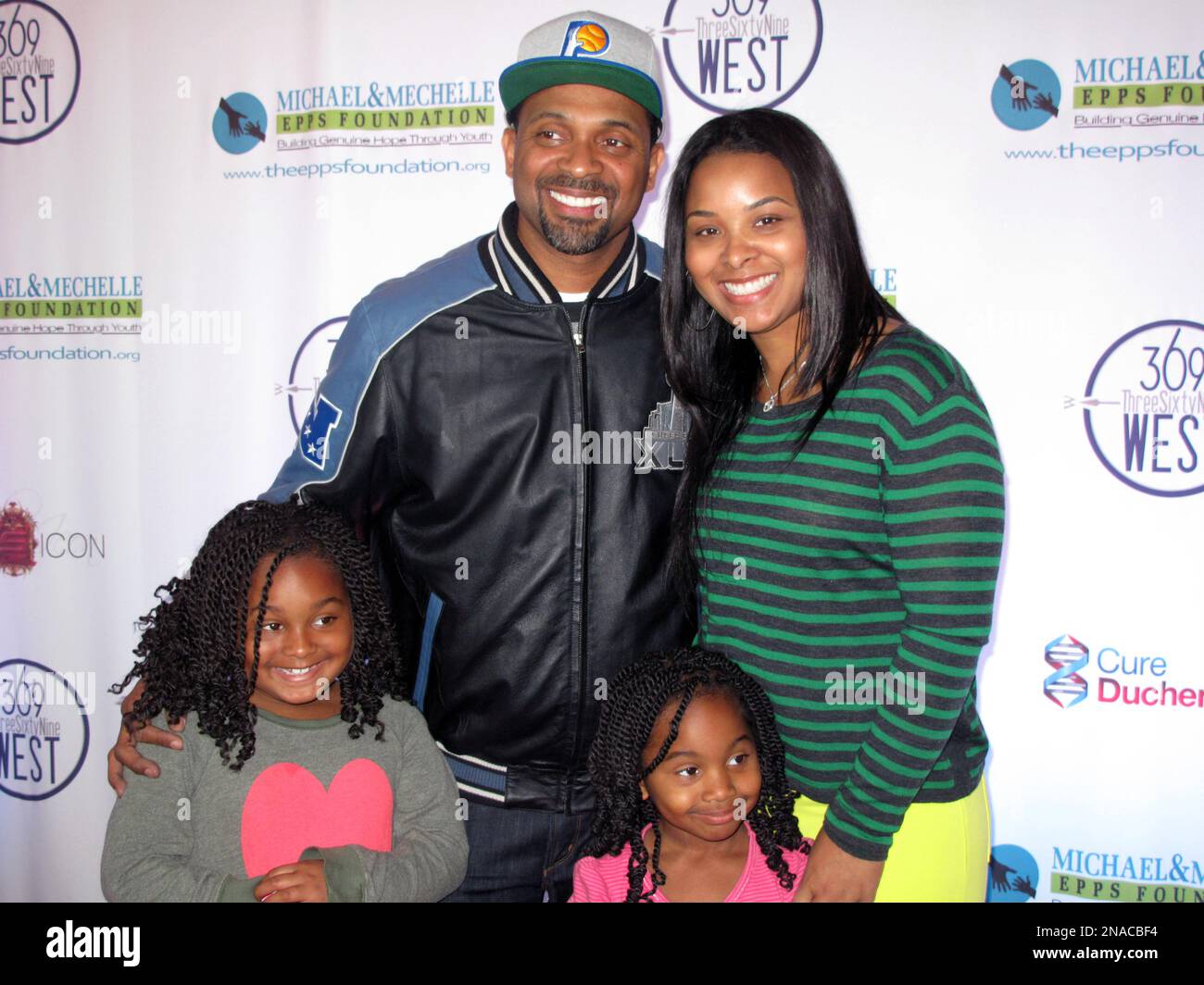 Actor-comedian Mike Epps poses with his family, wife Mechelle, and daughters Mariah, left, and ...
