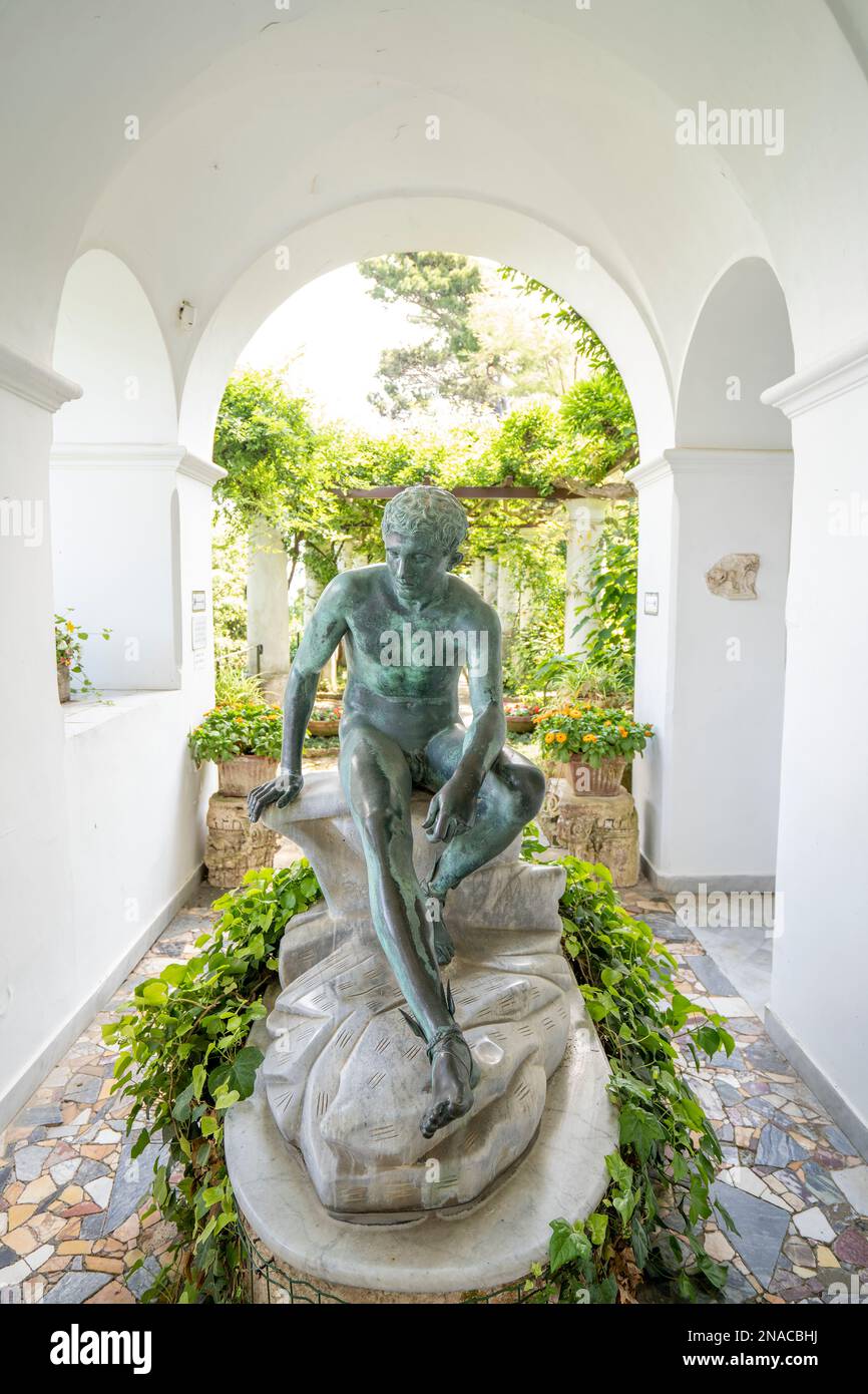 Statue decorate an ornate terrace and gardens in a villa on the island ...