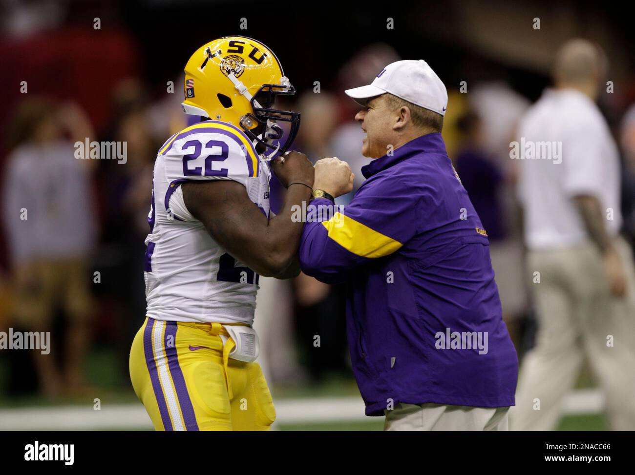 LSU Tigers Head Coach Les Miles bumps arms with LSU's linebacker Ryan ...