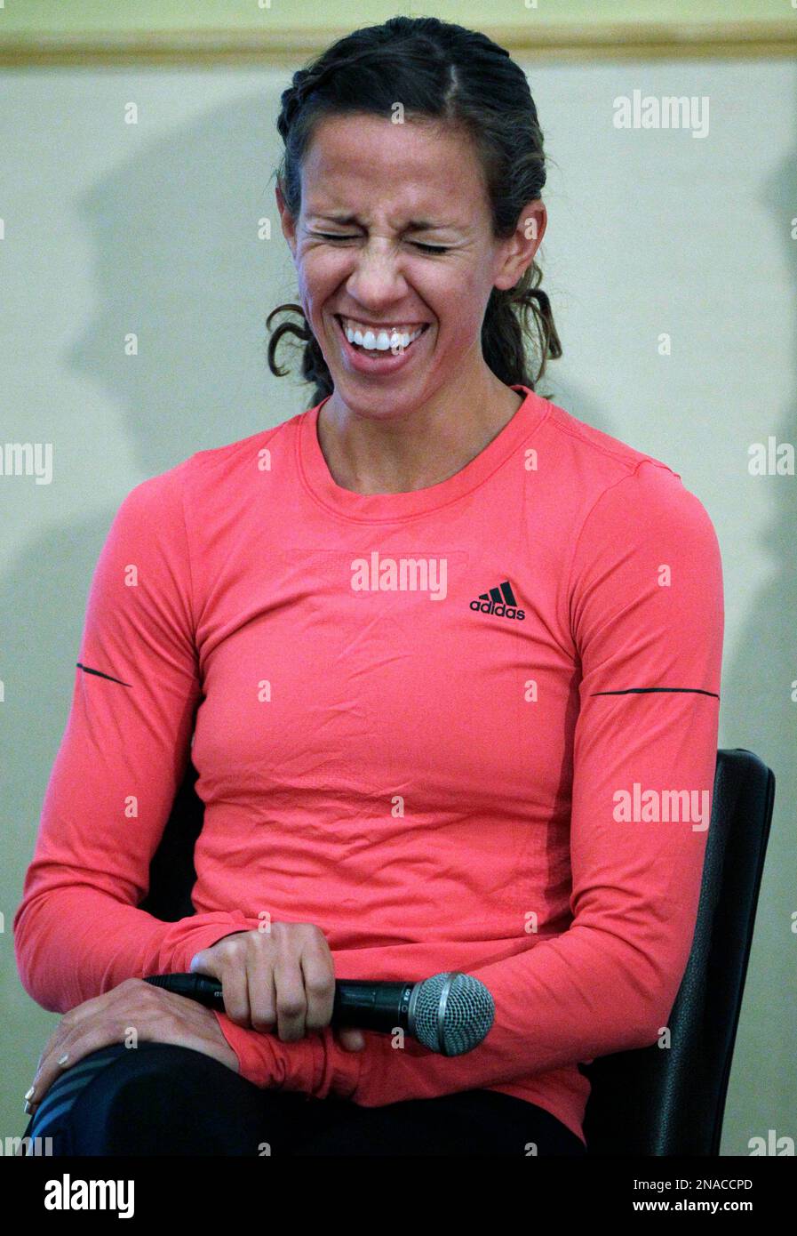 Morgan Uceny smiles as she prepares to answer a question during a news ...
