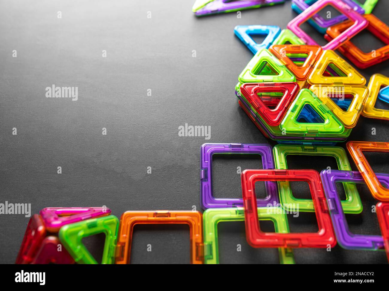 Details of a magnetic constructor on a dark background Stock Photo - Alamy