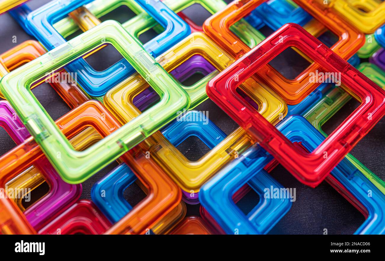 Details of a magnetic constructor on a dark background Stock Photo - Alamy