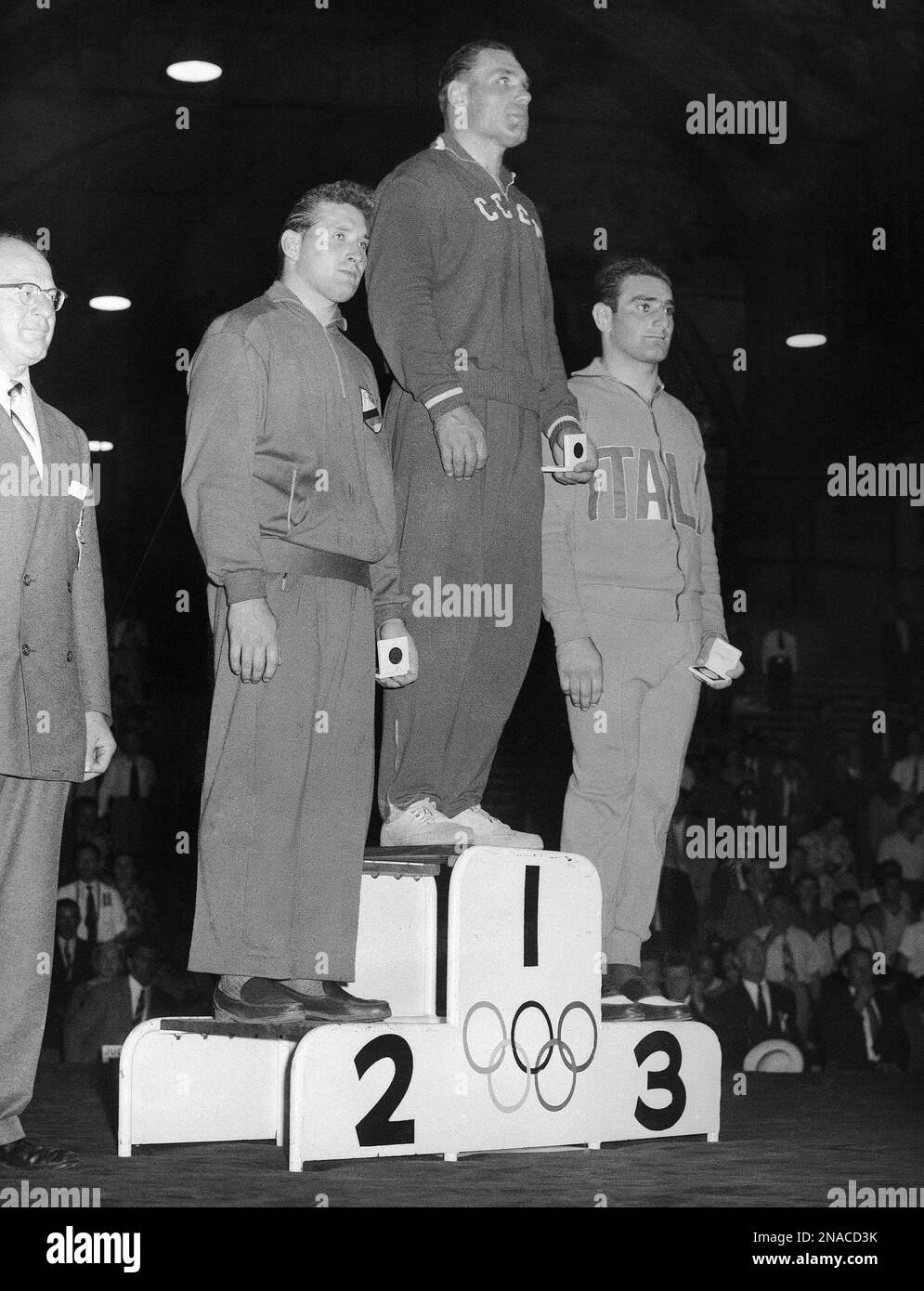 Heavyweight Greco-Roman wrestling victors on the podium after the ...