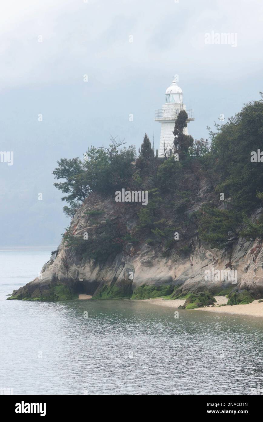 A photo shows a lighthouse at Okunoshima (Usagi Shima / Rabbit Island ...