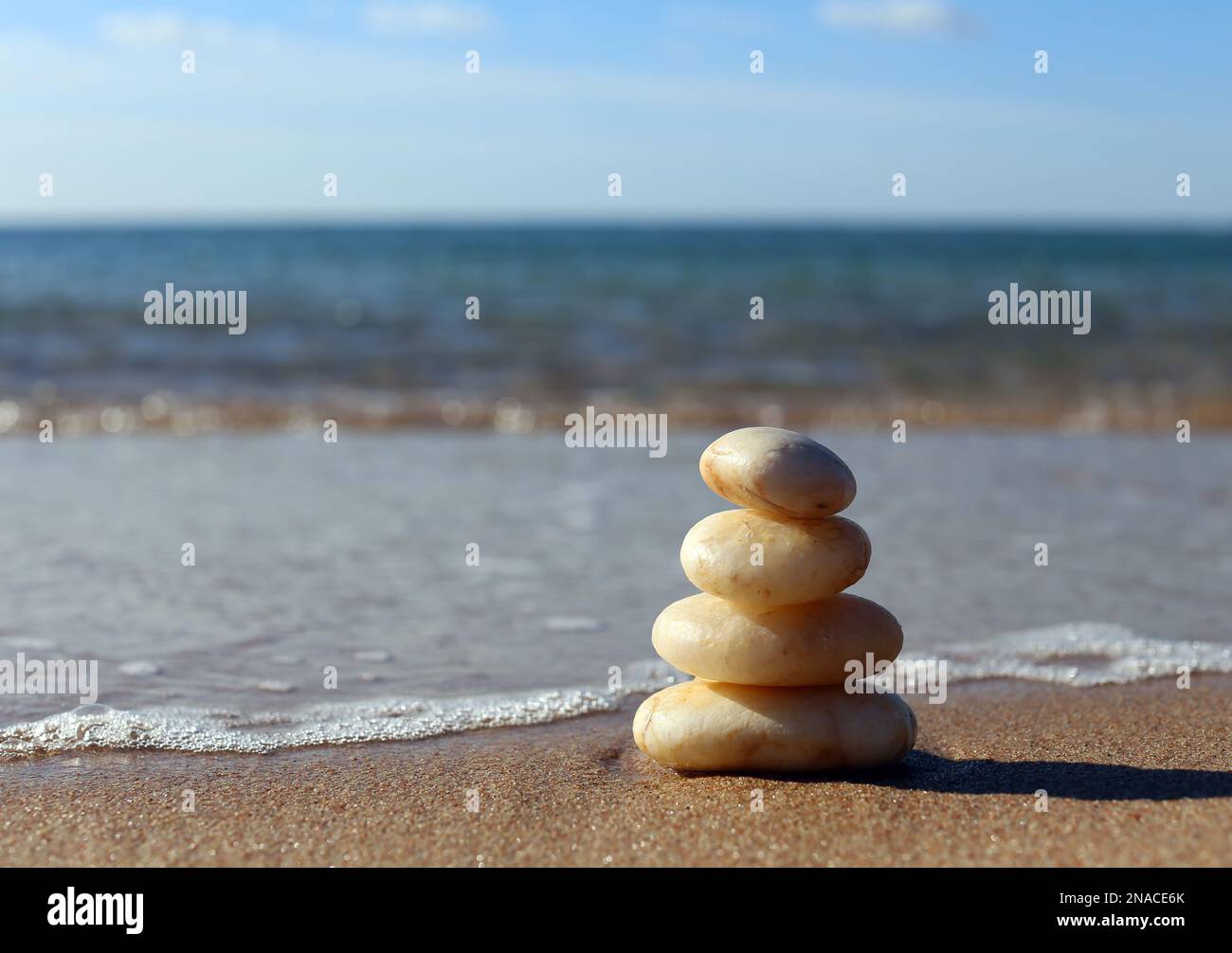 cairn on the beach ocean sea zen Stock Photo - Alamy